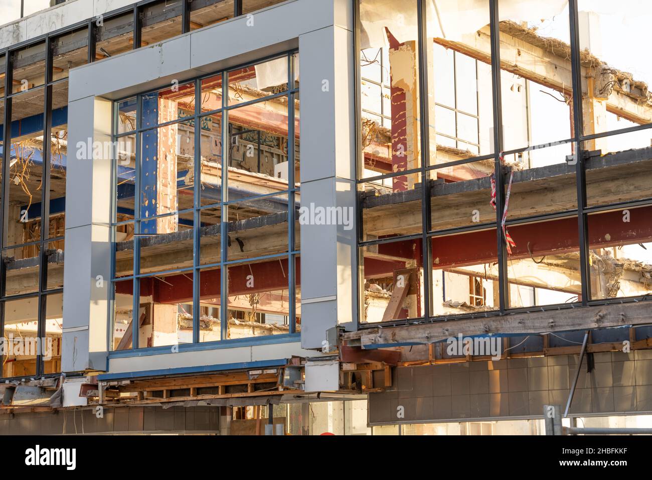 Downtown city building in state of partial demolition with structure ...