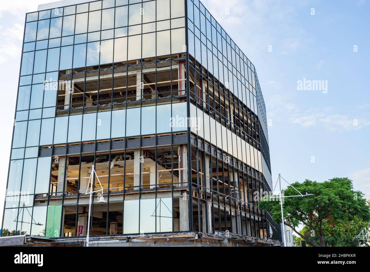 Downtown city building in state of partial demolition with structure ...