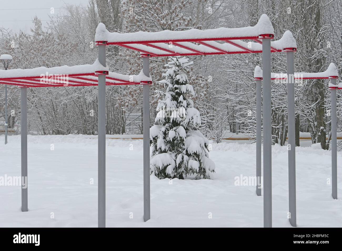 Winter cyclone. Snowfall in the city. Sports ground covered with snow ...