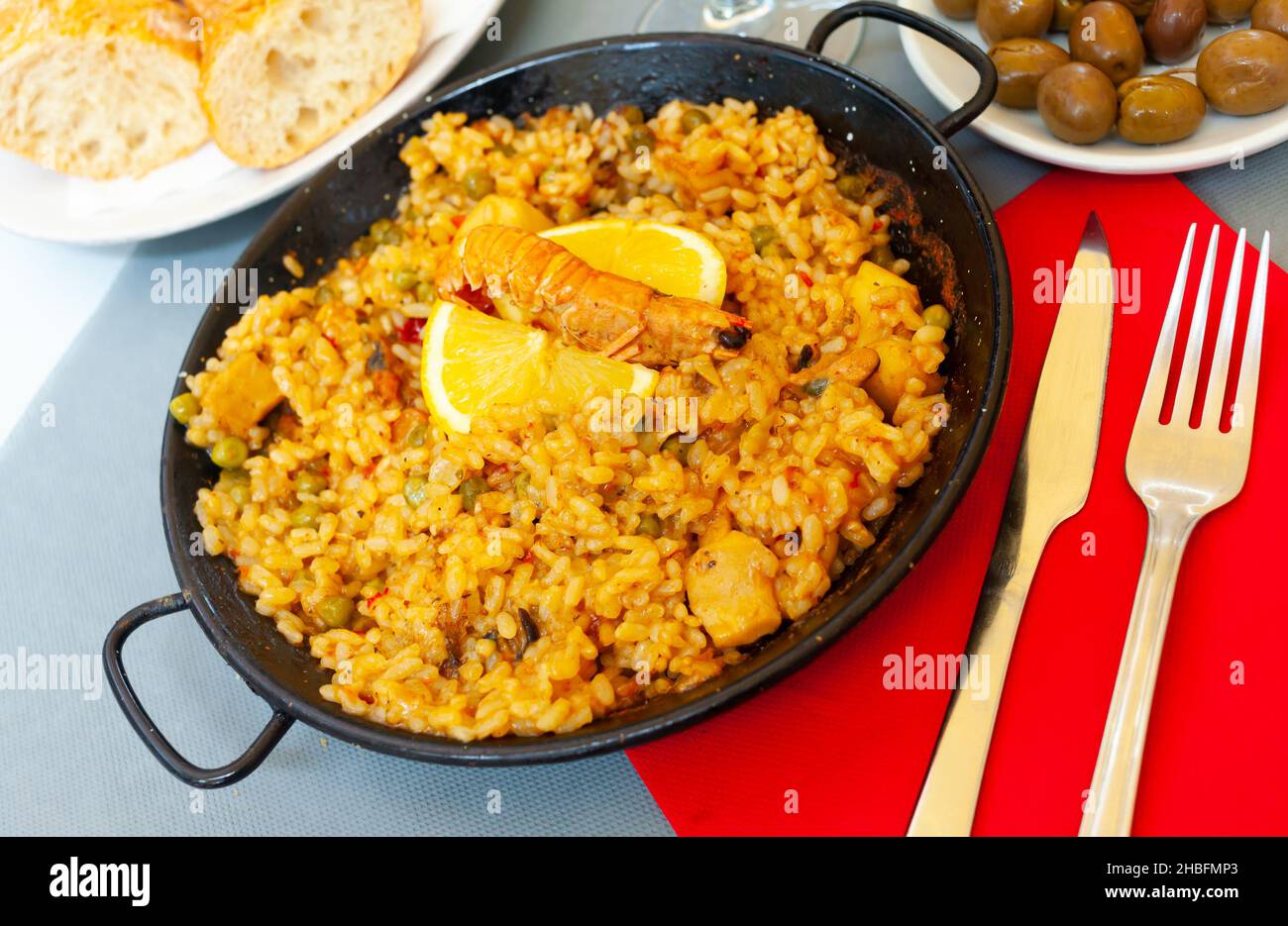 Spainsh dish seafood paella with rice, shrimps and mussels Stock Photo ...