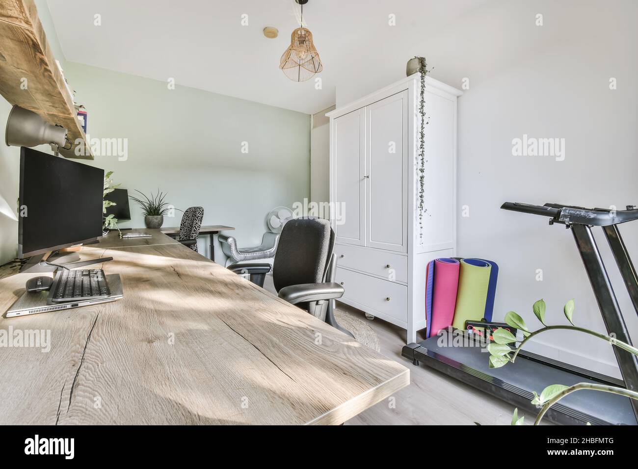 Sleek workspace for two with a computer and comfortable seating Stock ...