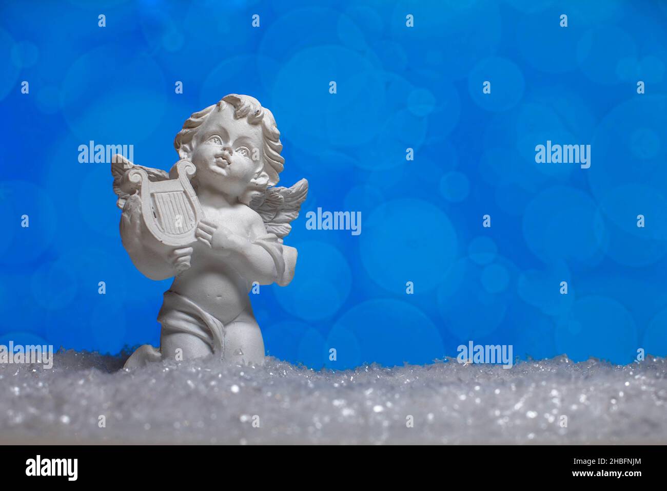 Ceramic angel statue standing on snow Stock Photo - Alamy