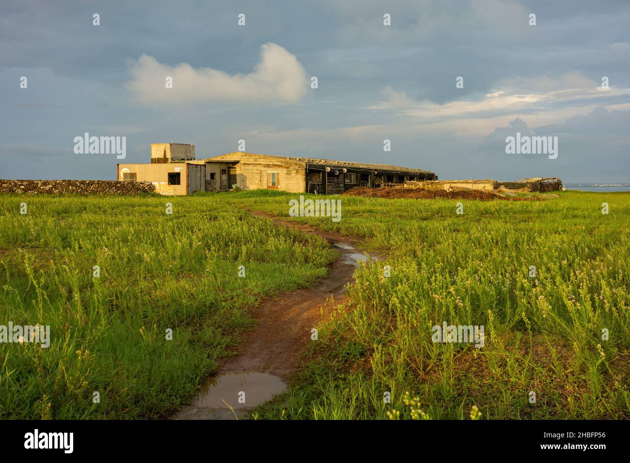 Sunset with a farm building at Penghu island, Taiwan Stock Photo - Alamy