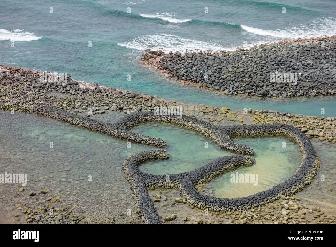 Twin Hearts Stone Weir in Penghu island at Taiwan Stock Photo - Alamy