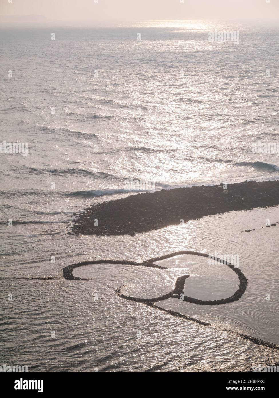 Twin Hearts Stone Weir in Penghu island at Taiwan Stock Photo - Alamy