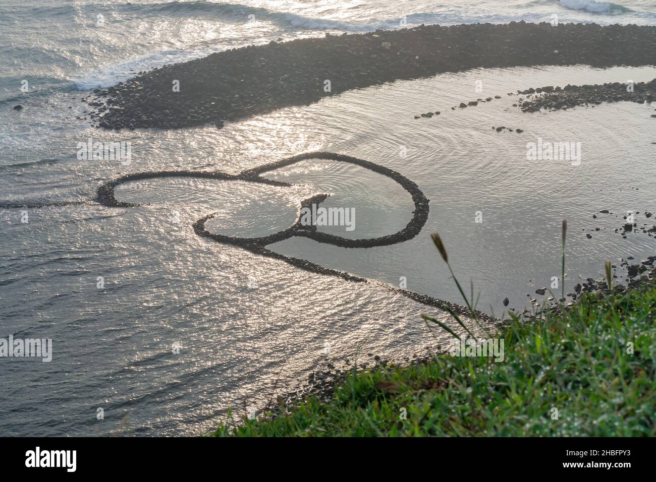 Twin Hearts Stone Weir in Penghu island at Taiwan Stock Photo - Alamy