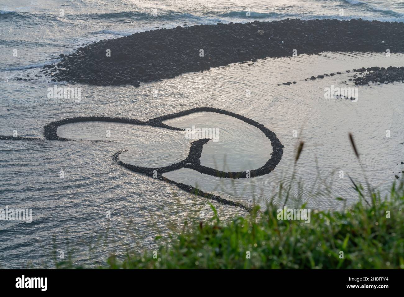Twin Hearts Stone Weir in Penghu island at Taiwan Stock Photo - Alamy