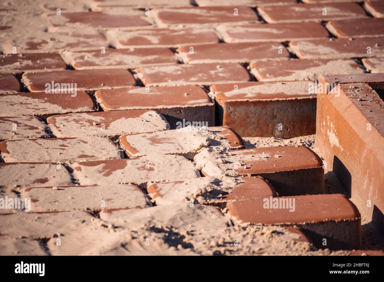 Brown concrete permeable flooring assembled on a substrate of sand ...