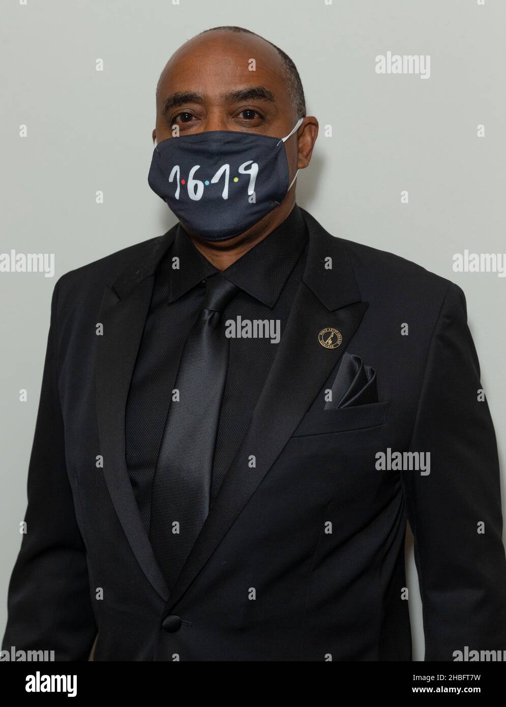 New York, NY - December 19, 2021: Mark Neely wearing mask depicting ...