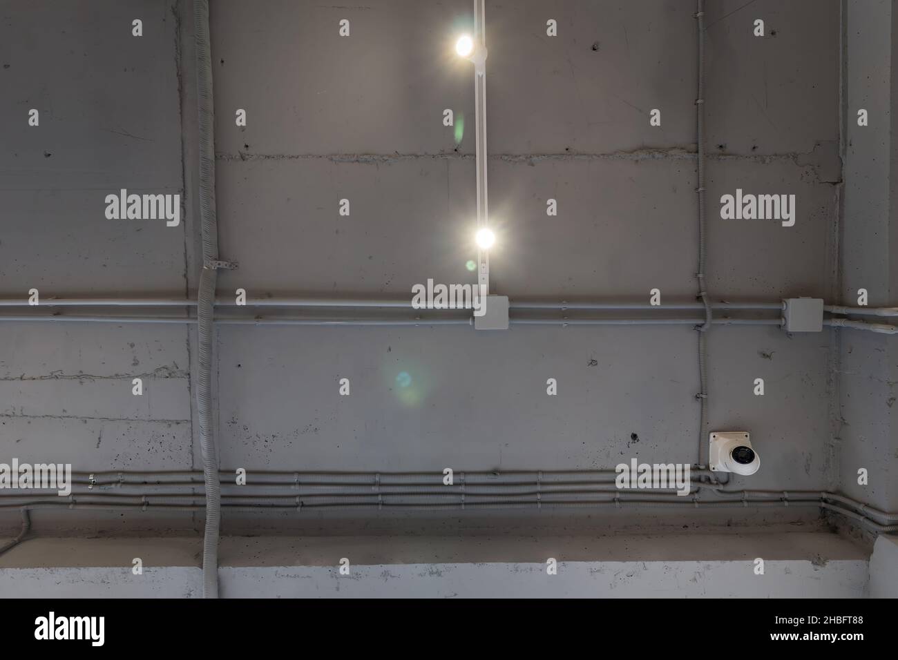 Abstract loft interior of concrete grey ceiling with air ventilation ...