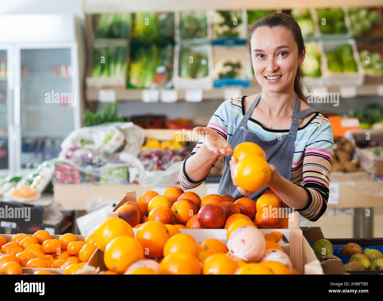 Store worker orange hi-res stock photography and images - Alamy