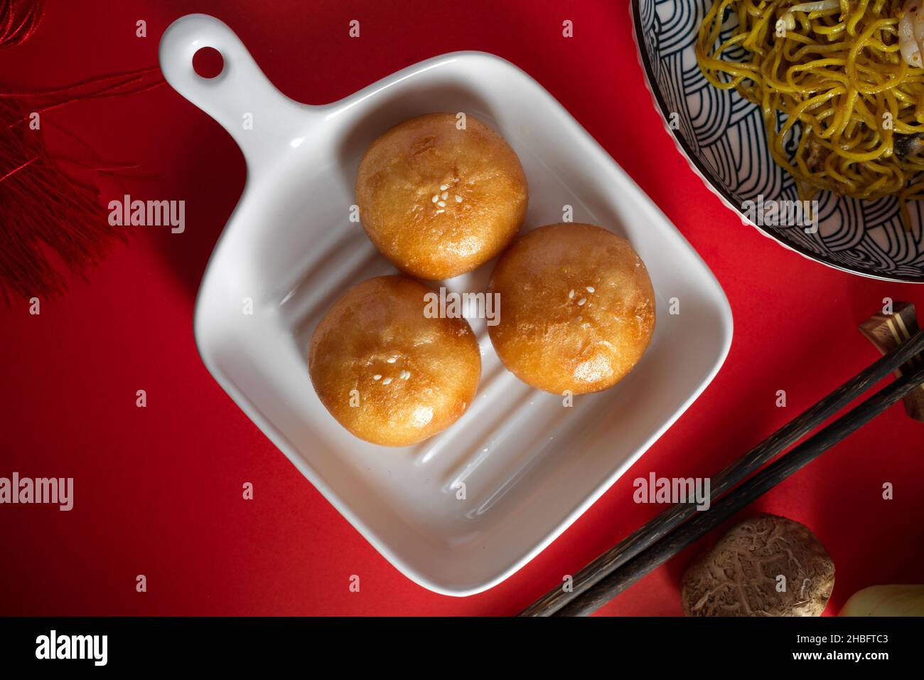 Top view, overhead view of a Chinese fried buns on a plate on red ...