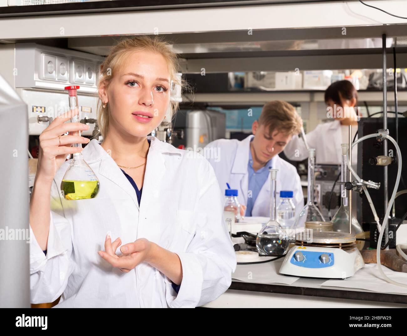 Scientist mixing chemicals hi-res stock photography and images - Alamy