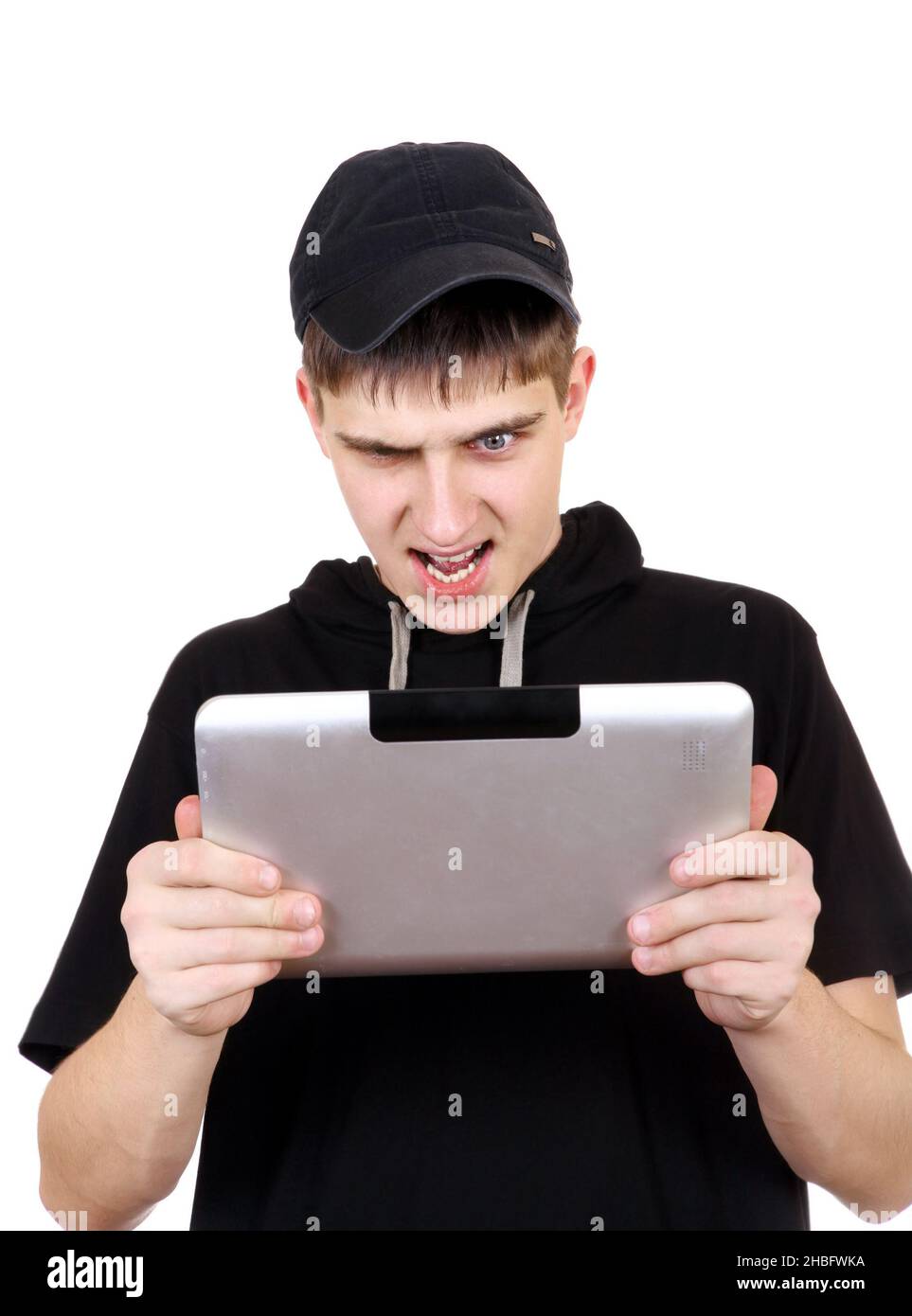 Angry Teenager with Tablet Computer Isolated on the White Background ...