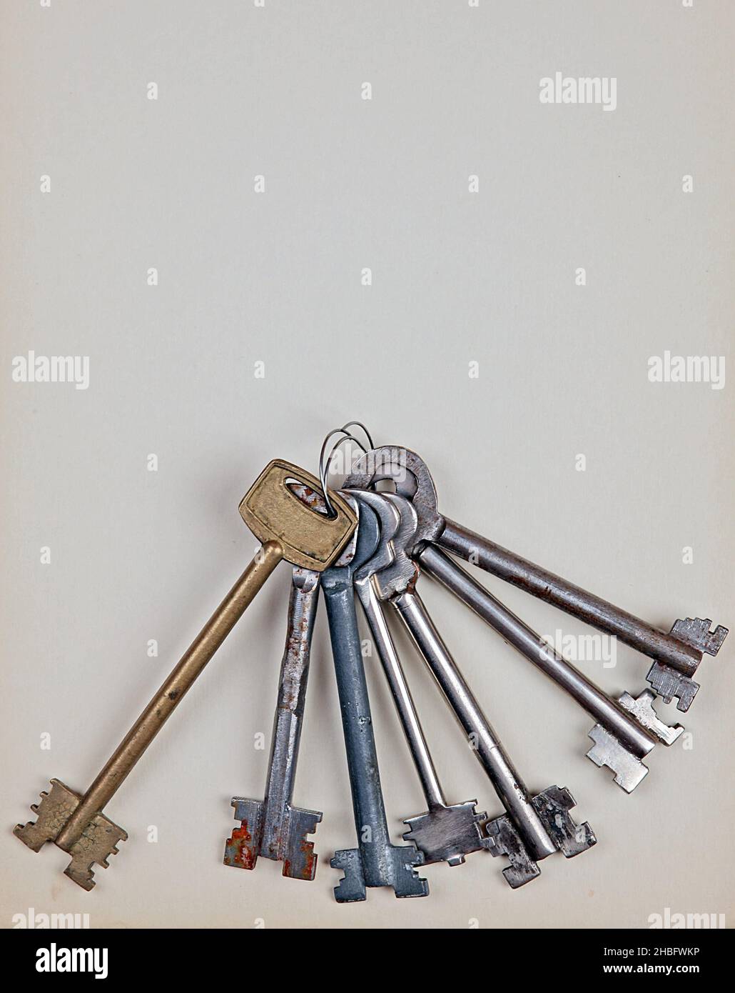 Bunch of Old Keys on the Paper background Stock Photo - Alamy