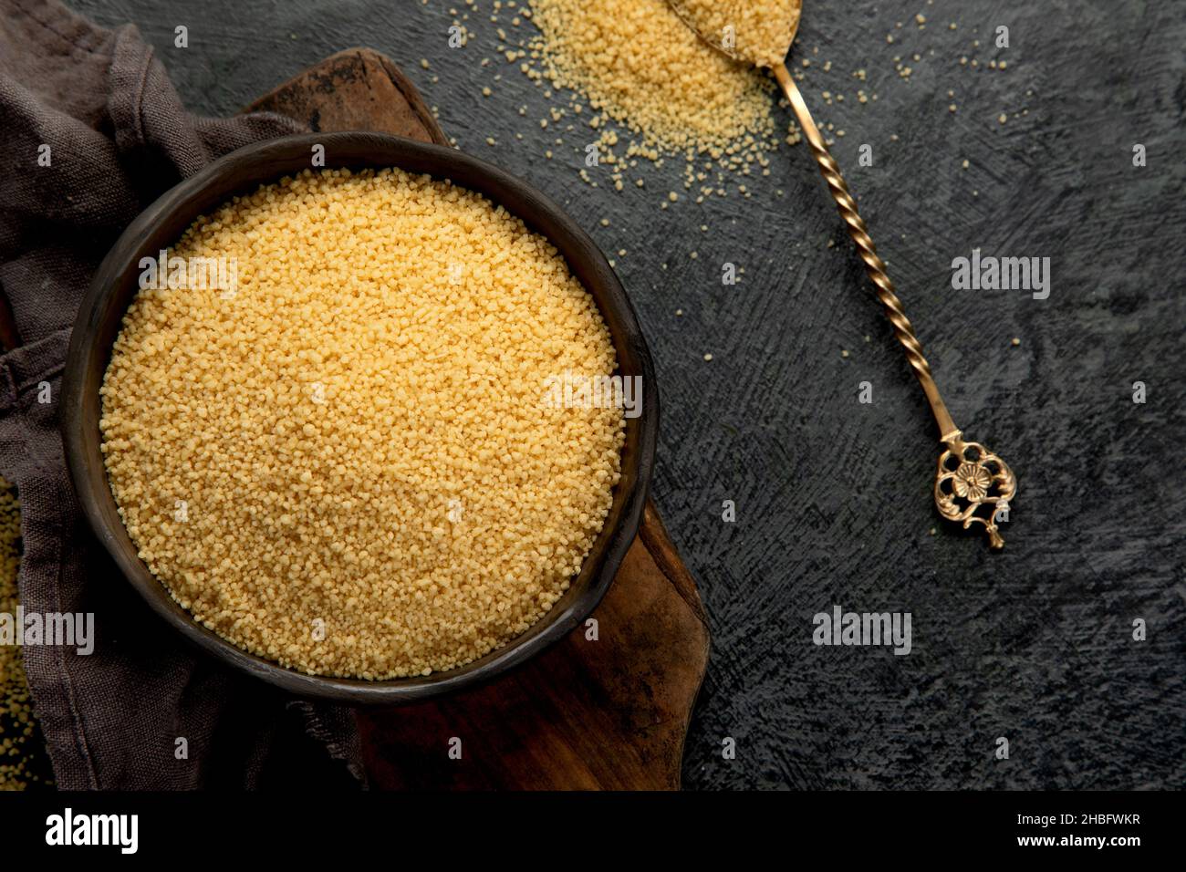 Couscous on dark background. Traditional whole grain. Top view, flat ...