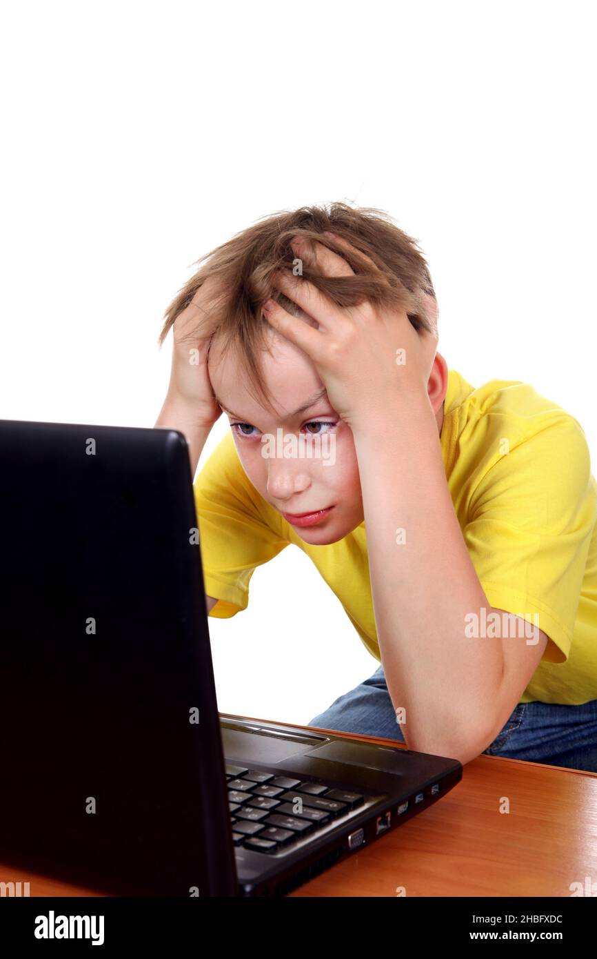 Troubled Kid at the Desk with Laptop Isolated on the White Background ...