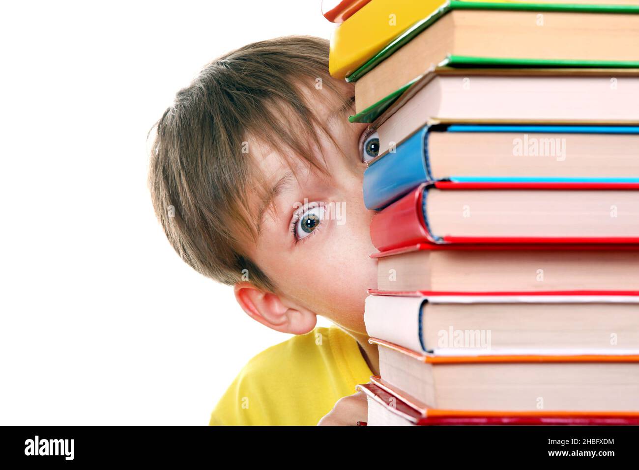 Surprised Kid behind the Books Isolated on the White Background Stock ...