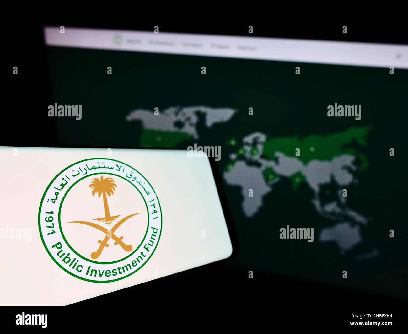 Cellphone with logo of Saudi Arabian Public Investment Fund (PIF) on ...