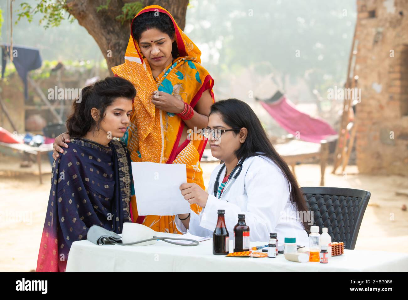 Young Indian adult girl with her mother getting proscription medicine ...