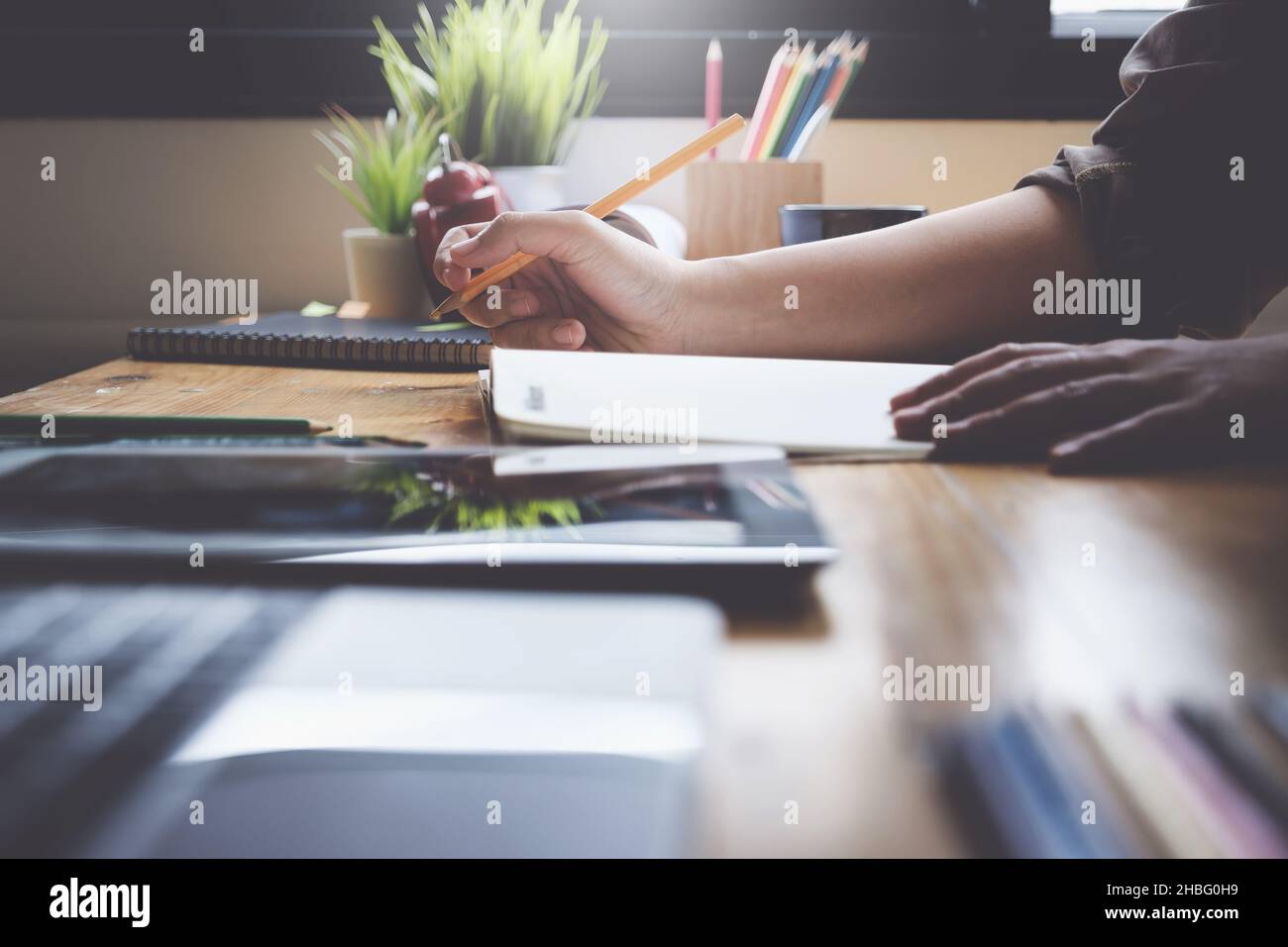 Architect or Creative woman thinking or planing with her project at ...