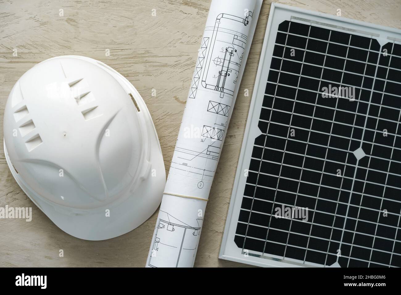 Blueprint roll and solar panel, home project Stock Photo - Alamy