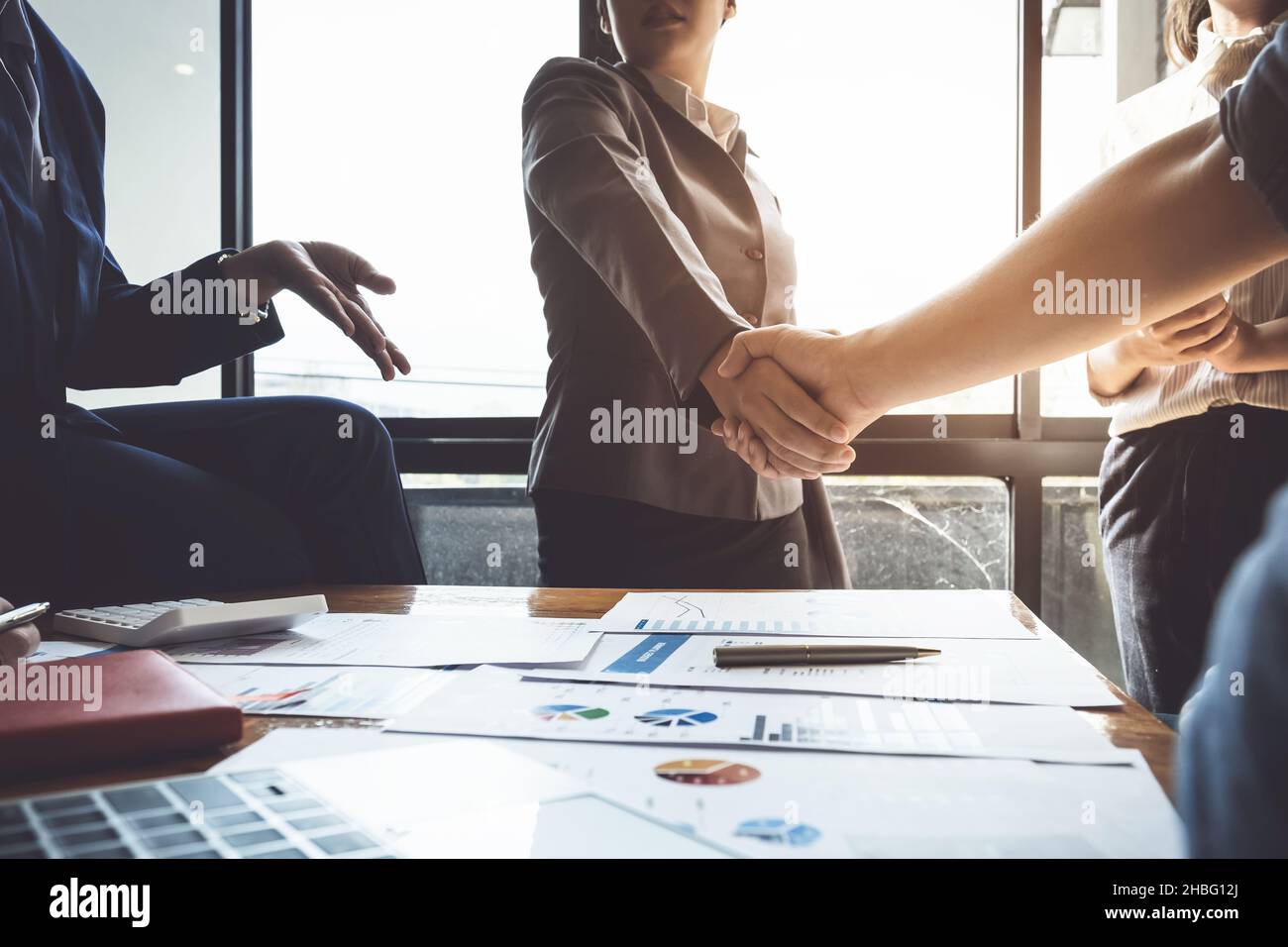 Business team and partnership handshake after successful discuss about ...