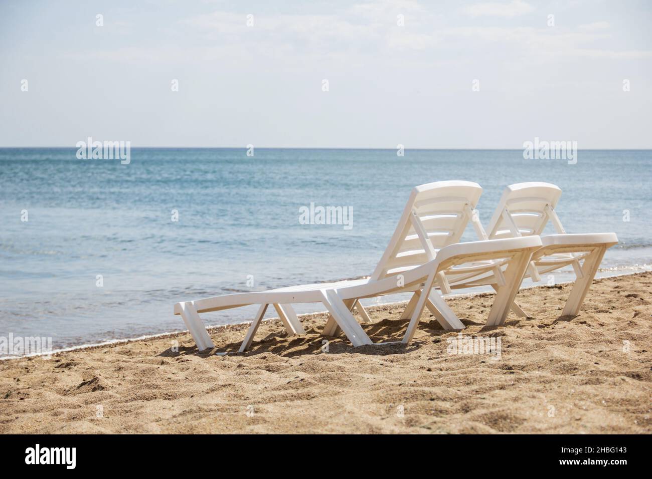 Sun loungers by the sea. For the screensaver. Summer background. Rest ...