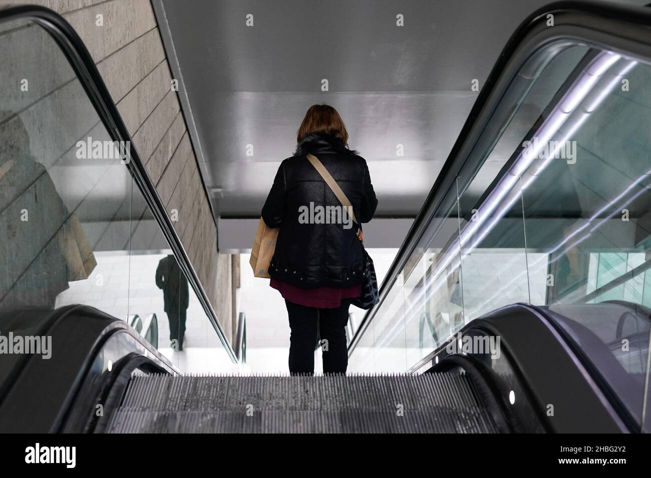 Using an escalator Stock Photo - Alamy