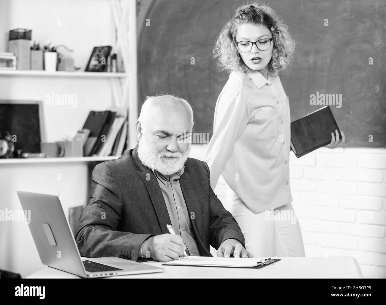 School education concept. Check homework. Educator and student in ...