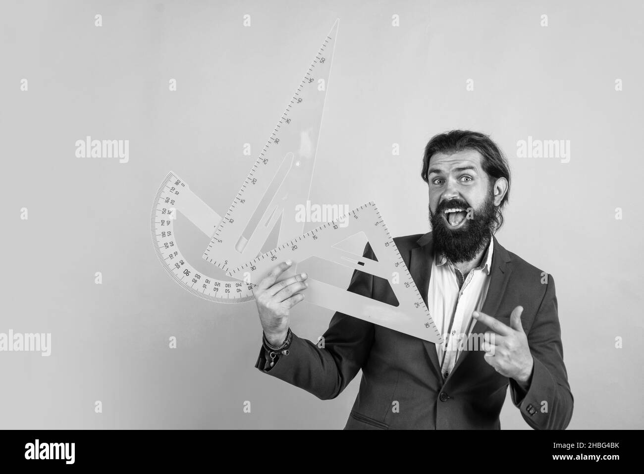 happy guy ready to study mathematics with triangle and protractor, stem ...