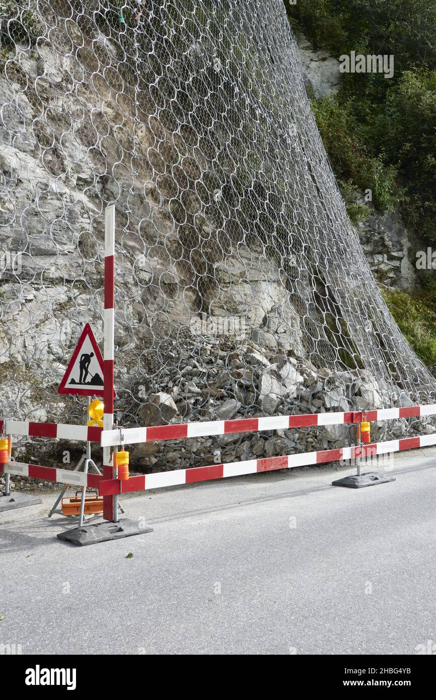 A vertical shot of the side of a road in the Switzerland countryside ...