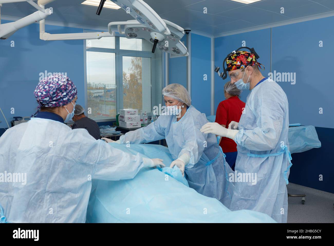 Concentrated Surgical team operating a patient in an operation theater ...