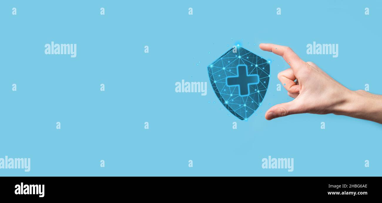 Businessman hold Shield with plus Low polygonal icon, medicine icon ...