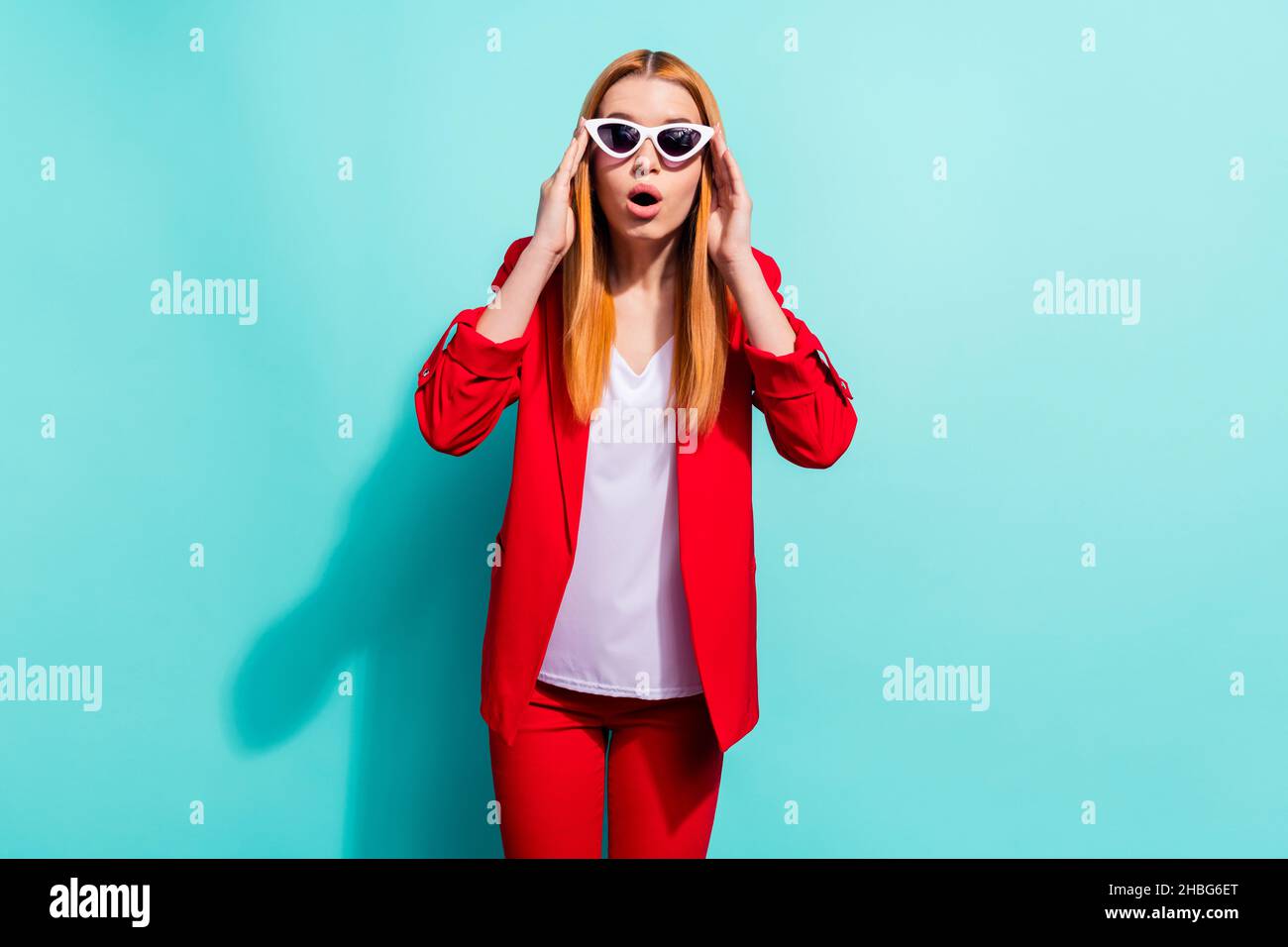 Photo of cute shocked orange hair lady wear red blazer dark glasses ...