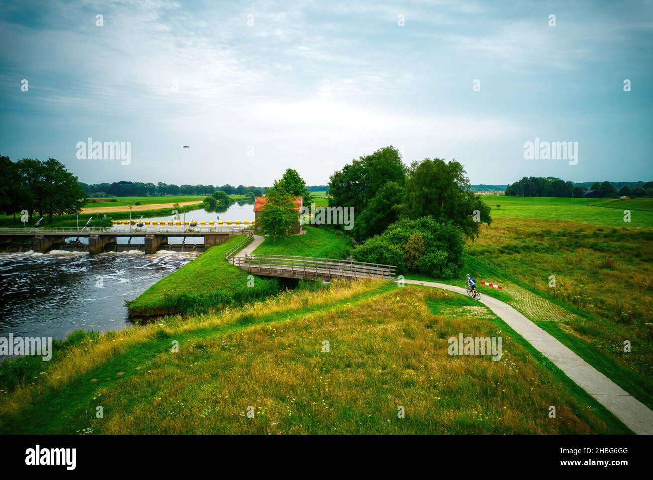 Drone view of the river Vecht, green grass, trees, beautiful blue sky ...