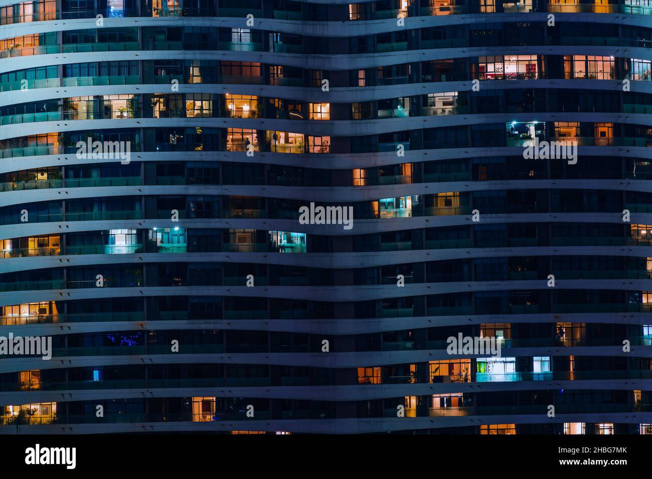 Glass facade of modern city high rise, buildings show lighting using by ...