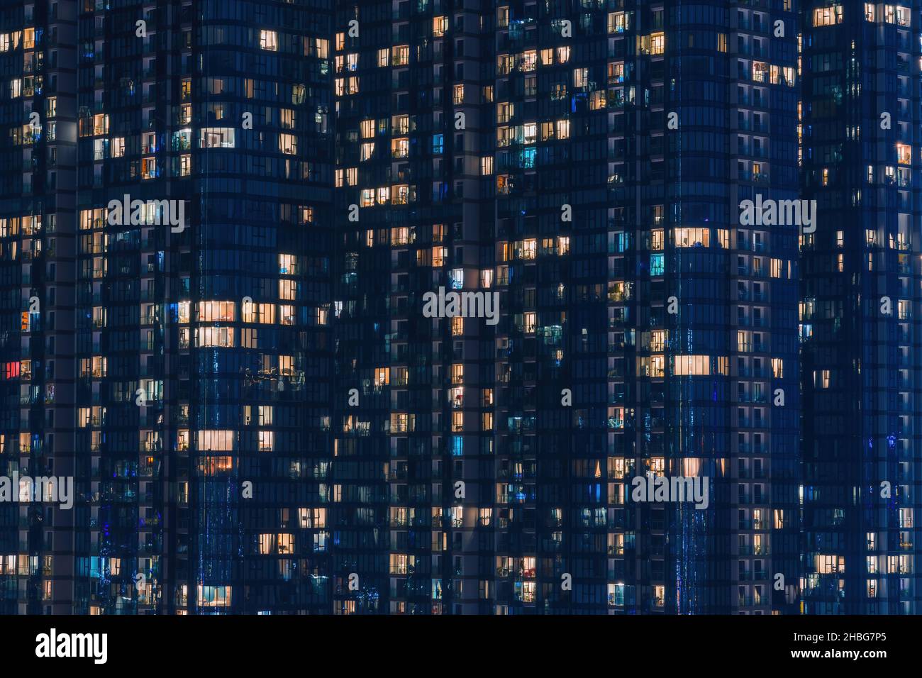 Glass facade of modern city high rise, buildings show lighting using by ...