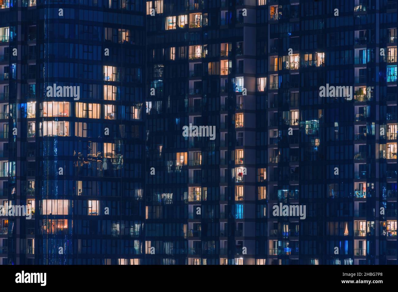 Glass facade of modern city high rise, buildings show lighting using by ...