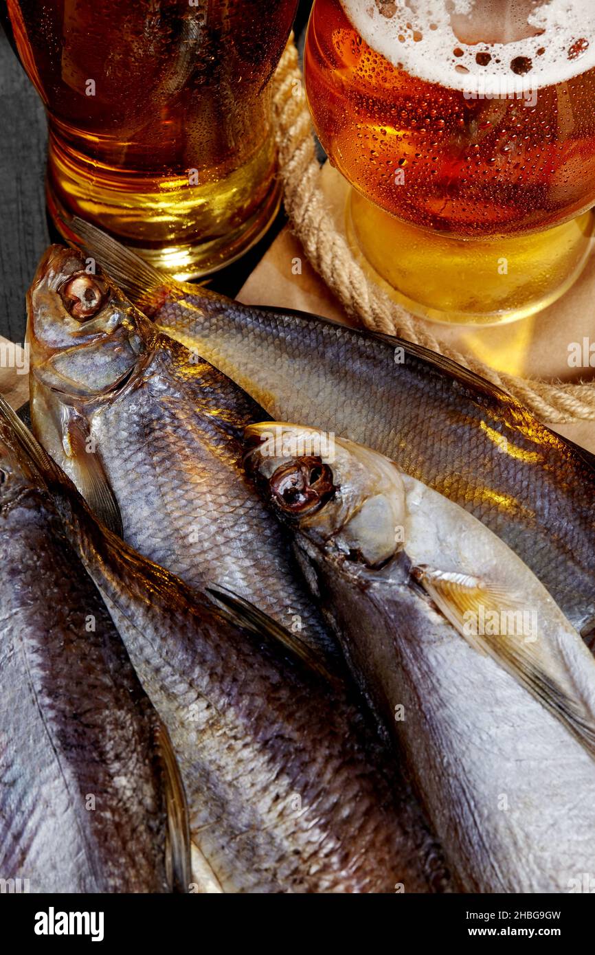 Closeup of salted air-dried roach fish, sabrefish and perch served with ...