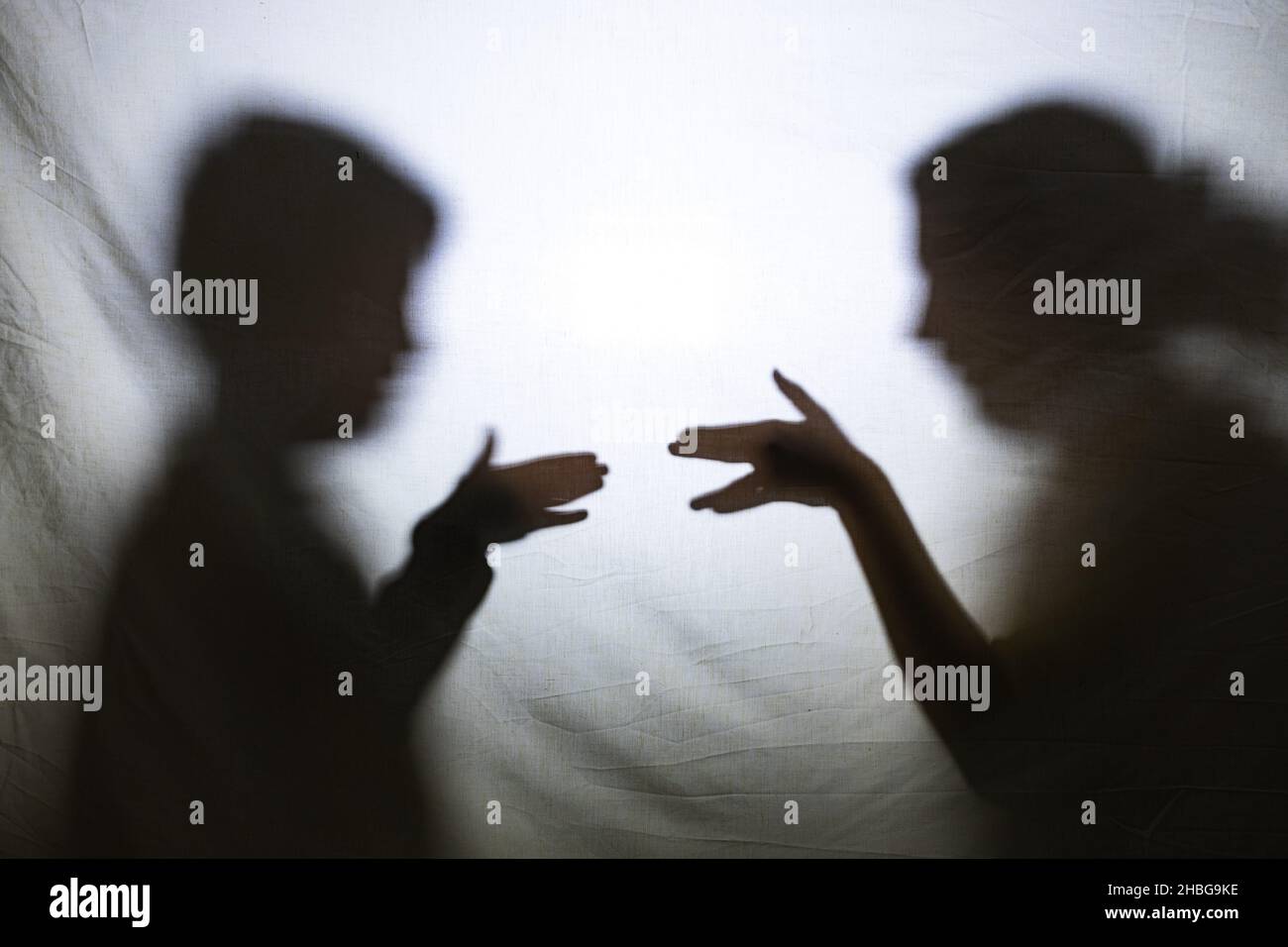 Mother and son playing with shadows behind a bed sheet Stock Photo - Alamy