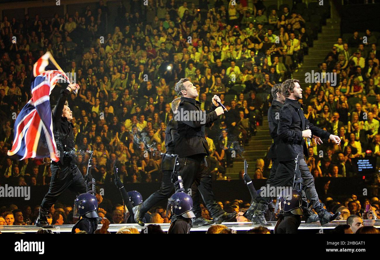 Take That perform on stage during the 2011 Brit Awards at the O2 Arena ...