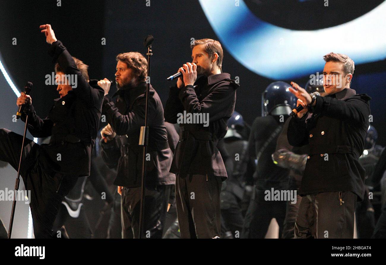 Take That perform on stage during the 2011 Brit Awards at the O2 Arena ...