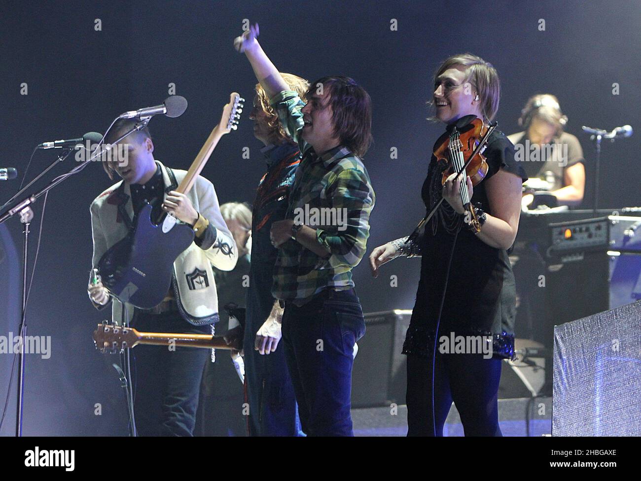 Arcade Fire perform on stage during the 2011 Brit Awards at the O2 ...