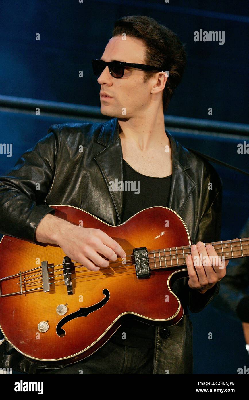 Nick Blood (Stuart Sutcliffe),of Backbeat (Beatles) performs on stage ...