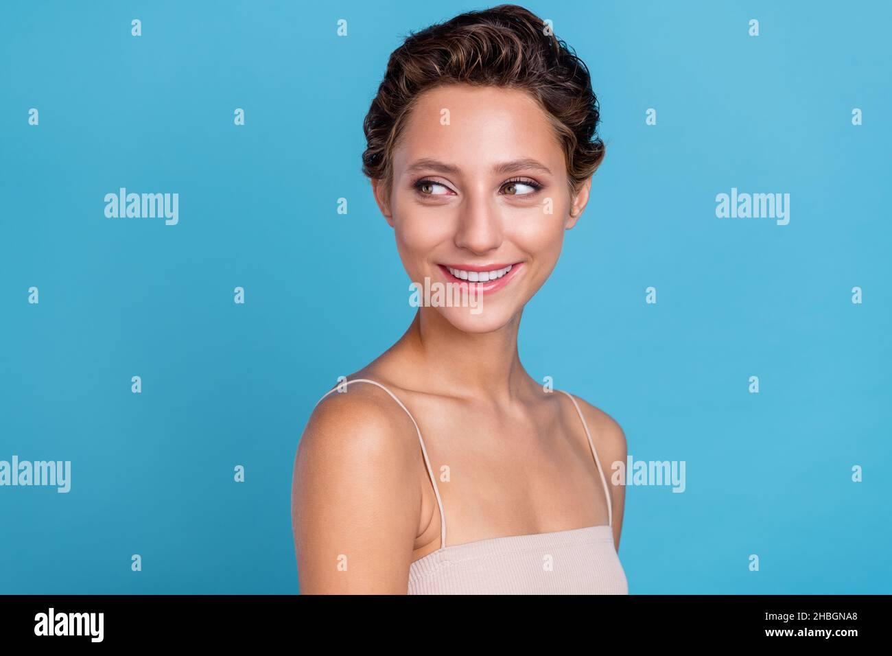 Photo of pretty shiny young woman dressed beige top looking back empty ...