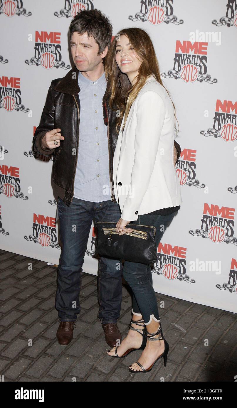 Noel Gallagher and wife Sara MacDonald arrive at the NME Awards at 02 ...