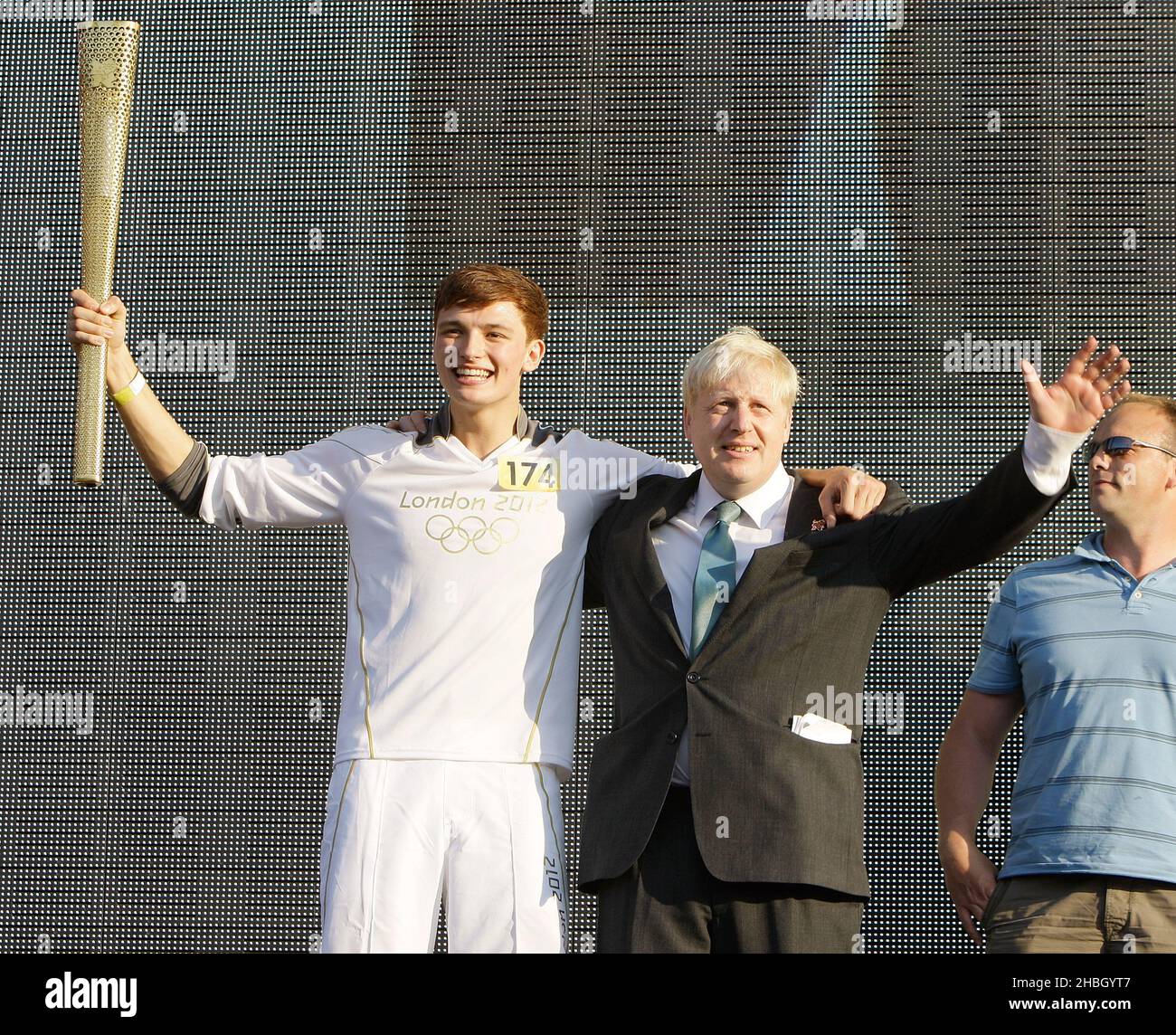 Tyler Rix and Mayor Boris Johnson with the Olympic Torch at Coca-Cola's ...