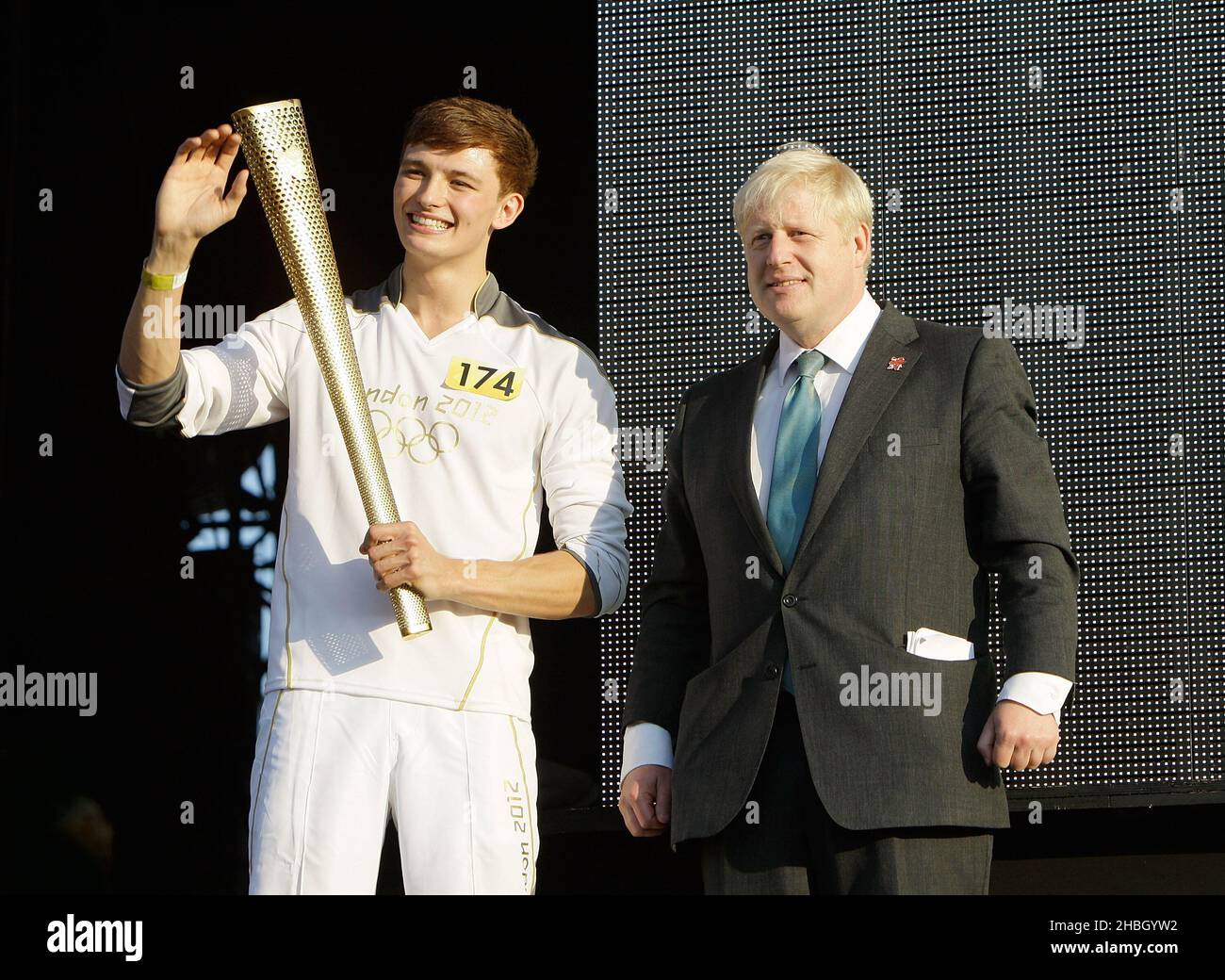Tyler Rix and Mayor Boris Johnson with the Olympic Torch at Coca-Cola's ...