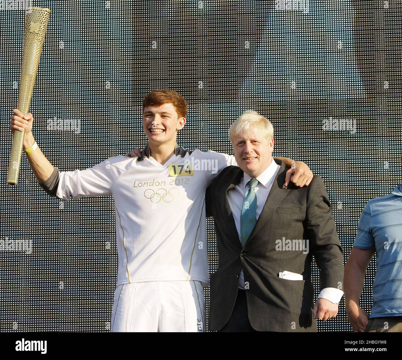 Tyler Rix and Mayor Boris Johnson with the Olympic Torch at Coca-Cola's ...